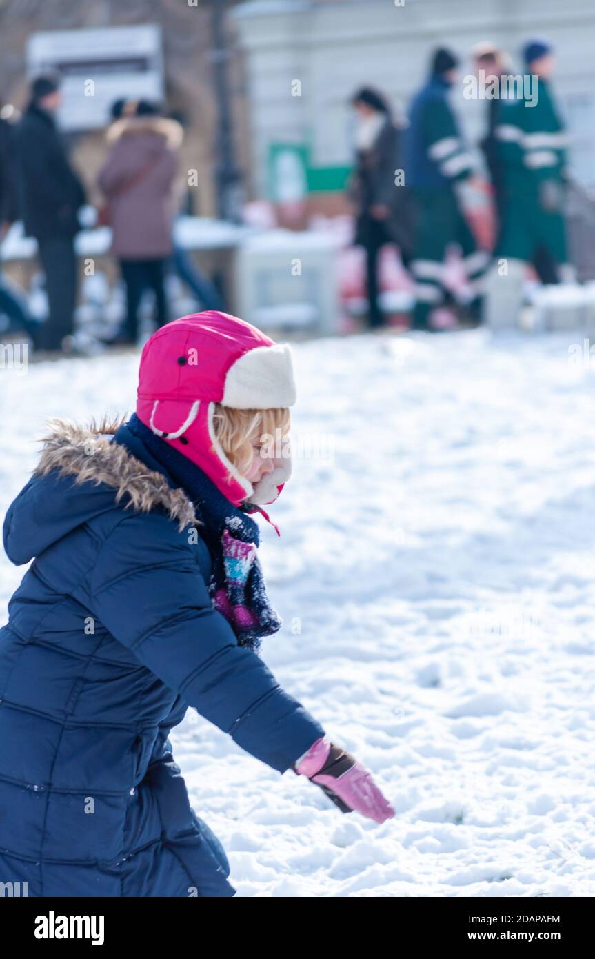Timisoara, Romania - January 30, 2014: Kids playing with snow in the ...