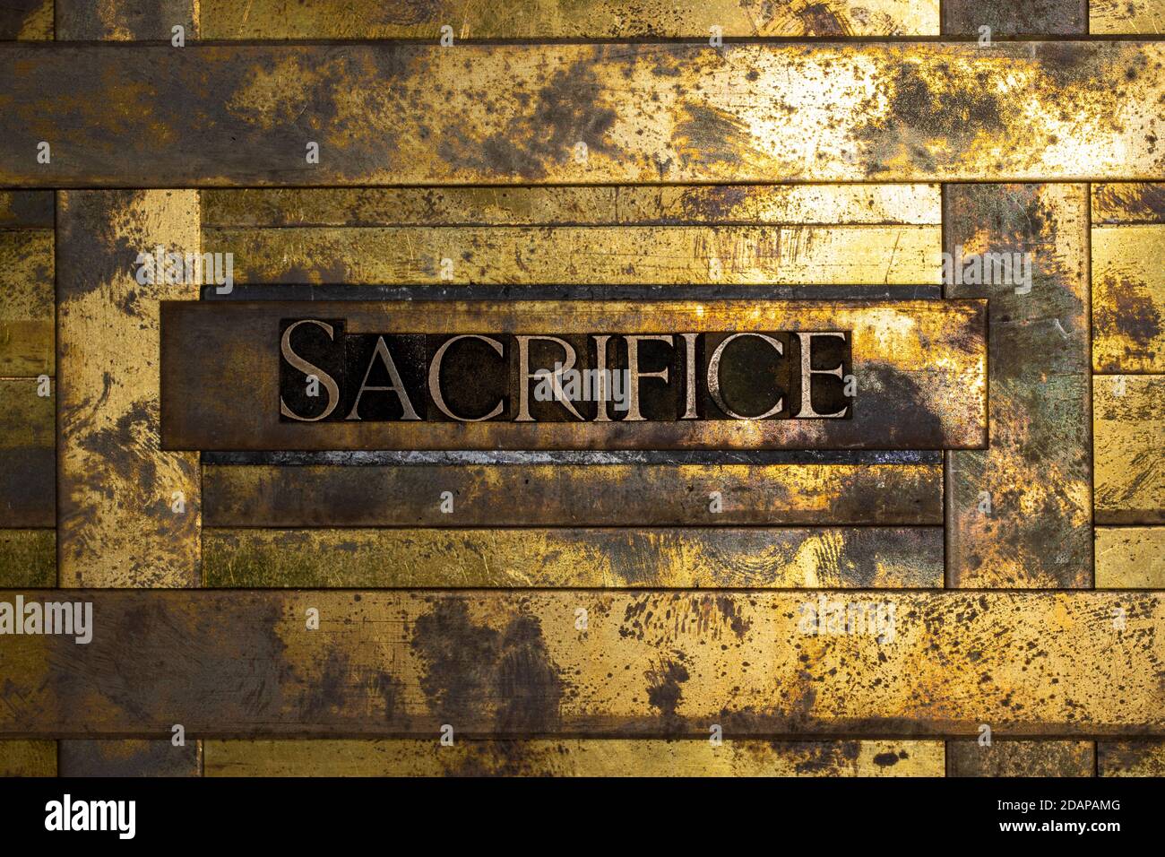 Sacrifice text on vintage textured grunge copper and gold background ...