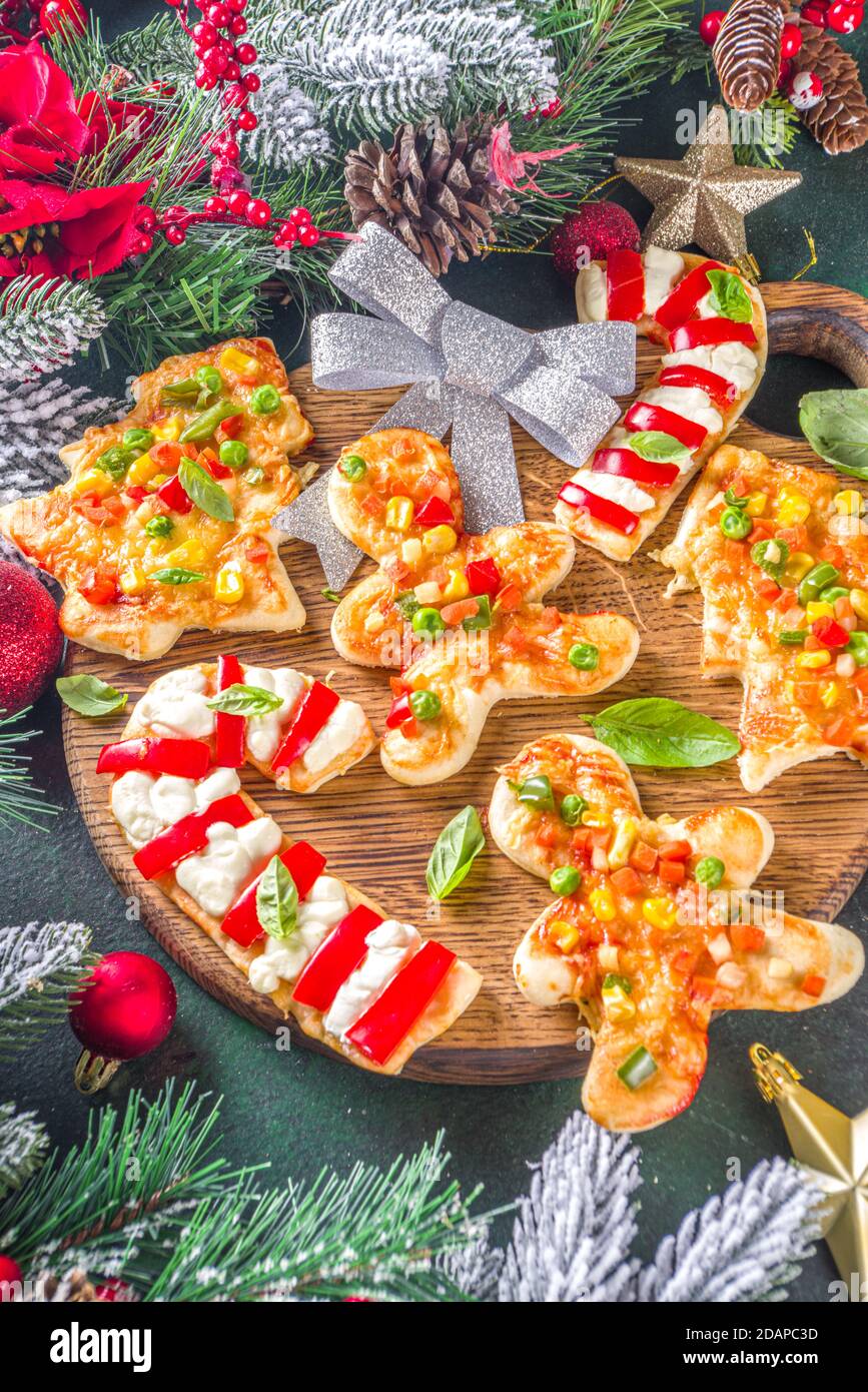 Christmas Pizza for child dinner, made with cookie cutters, in form of ...
