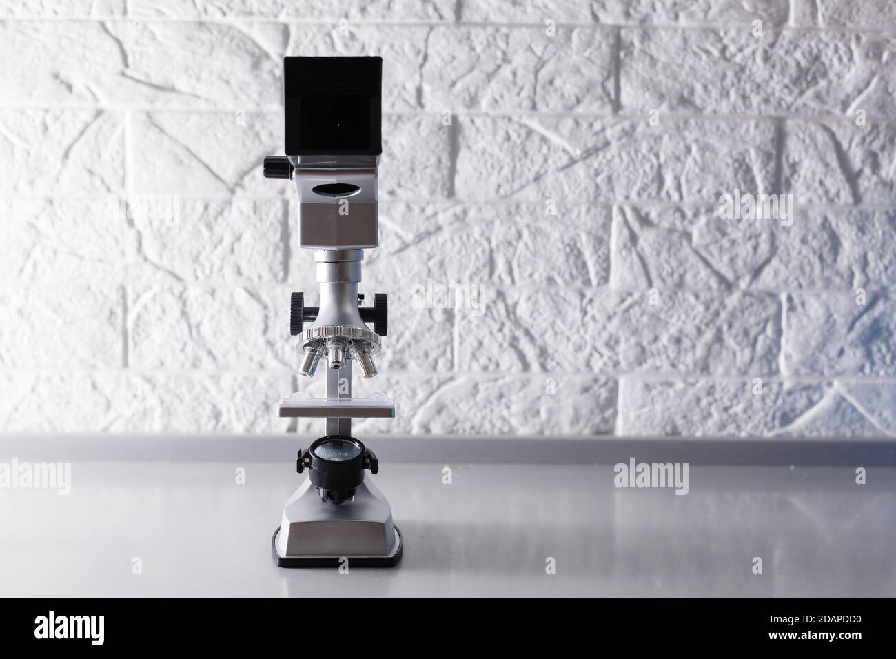 microscope stands on a table on a white background Stock Photo - Alamy