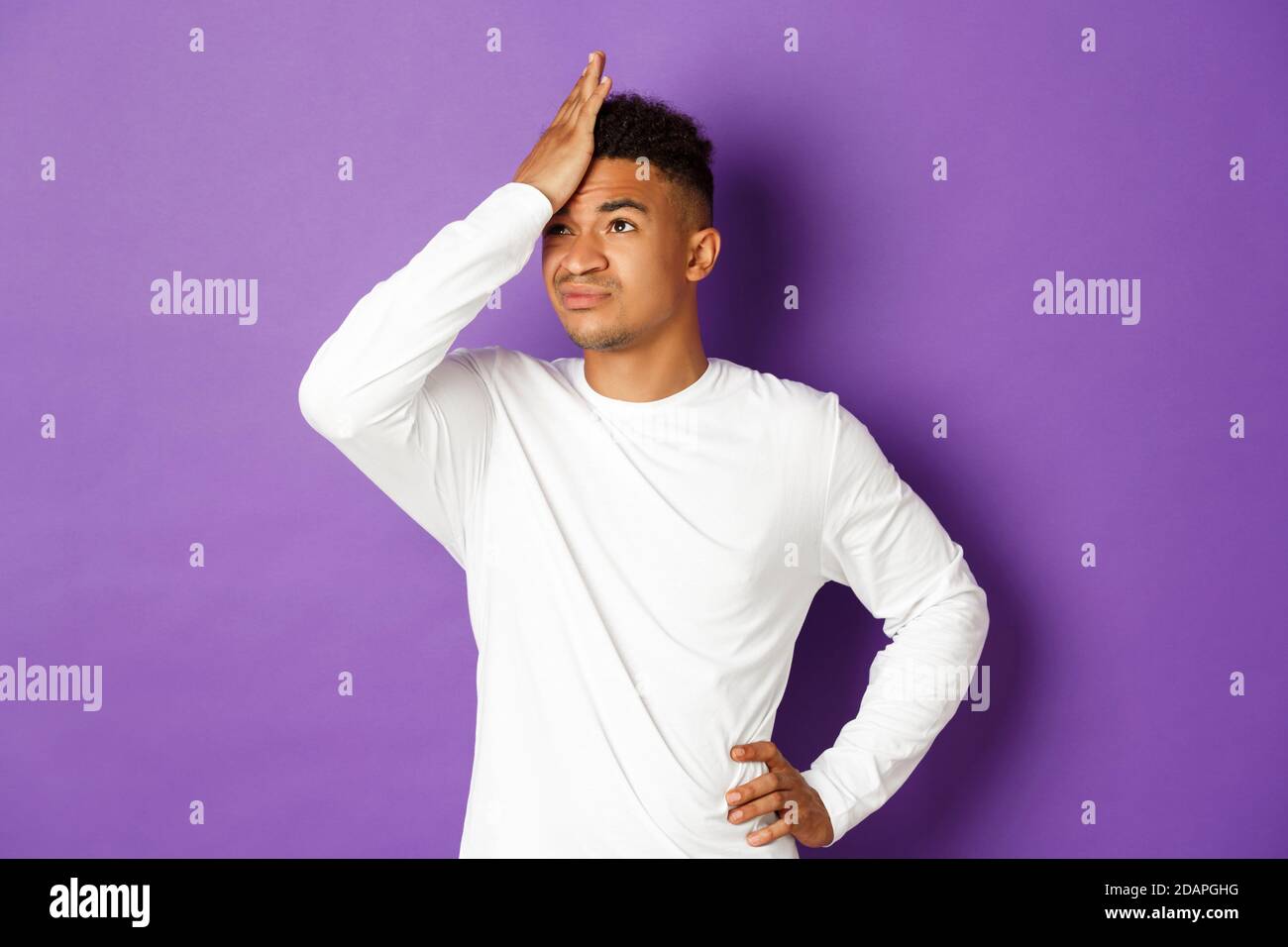 Image of annoyed and bothered african-american male student, slap ...