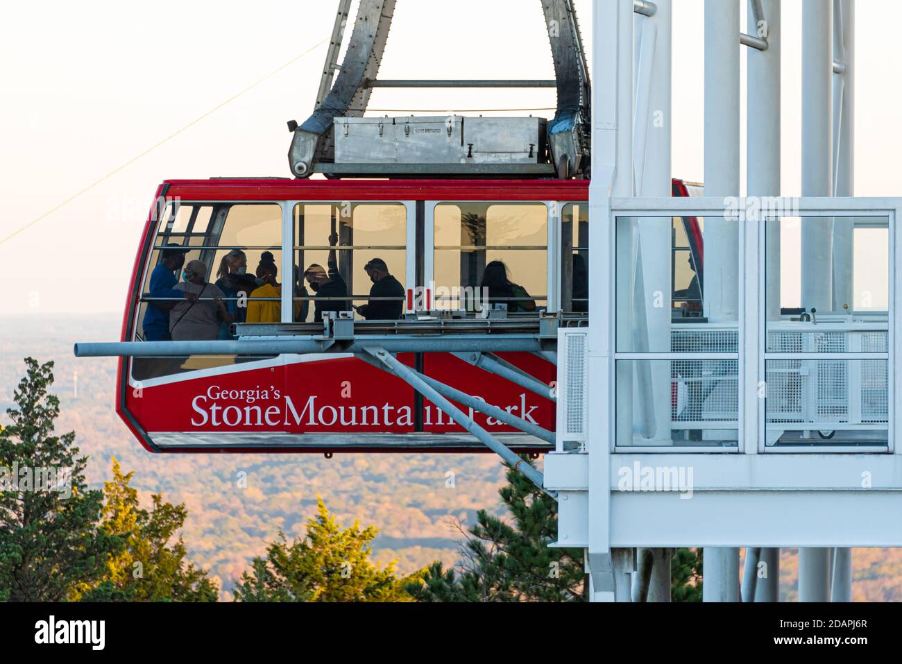 Passengers leaving the mountaintop terminal of the Stone Mountain Park ...