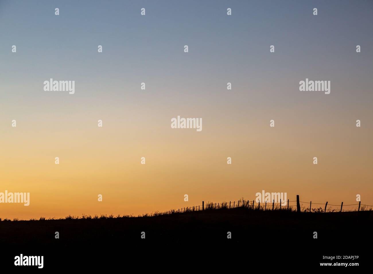 A sunset sky over fields in the South Downs Stock Photo - Alamy
