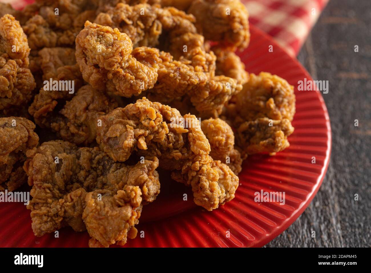 Fried and Crispy Chicken Gizzards on a Rustic Wooden Table Stock Photo ...