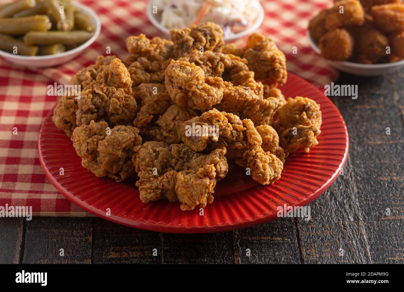 Fried and Crispy Chicken Gizzards on a Rustic Wooden Table Stock Photo ...