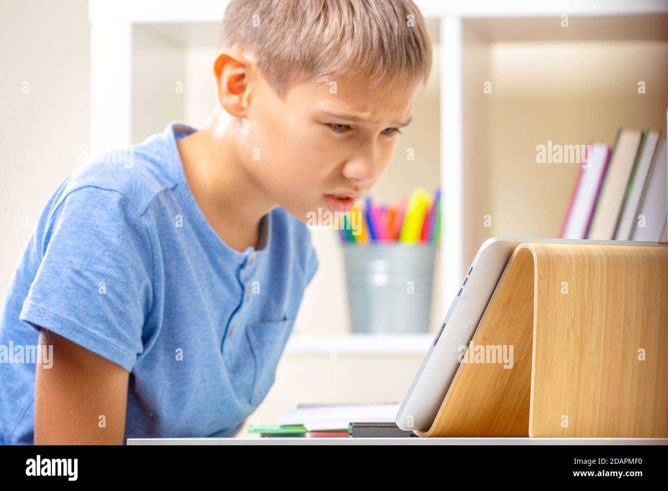 Confused upset teenage boy stuck with homework. Kid having learning ...