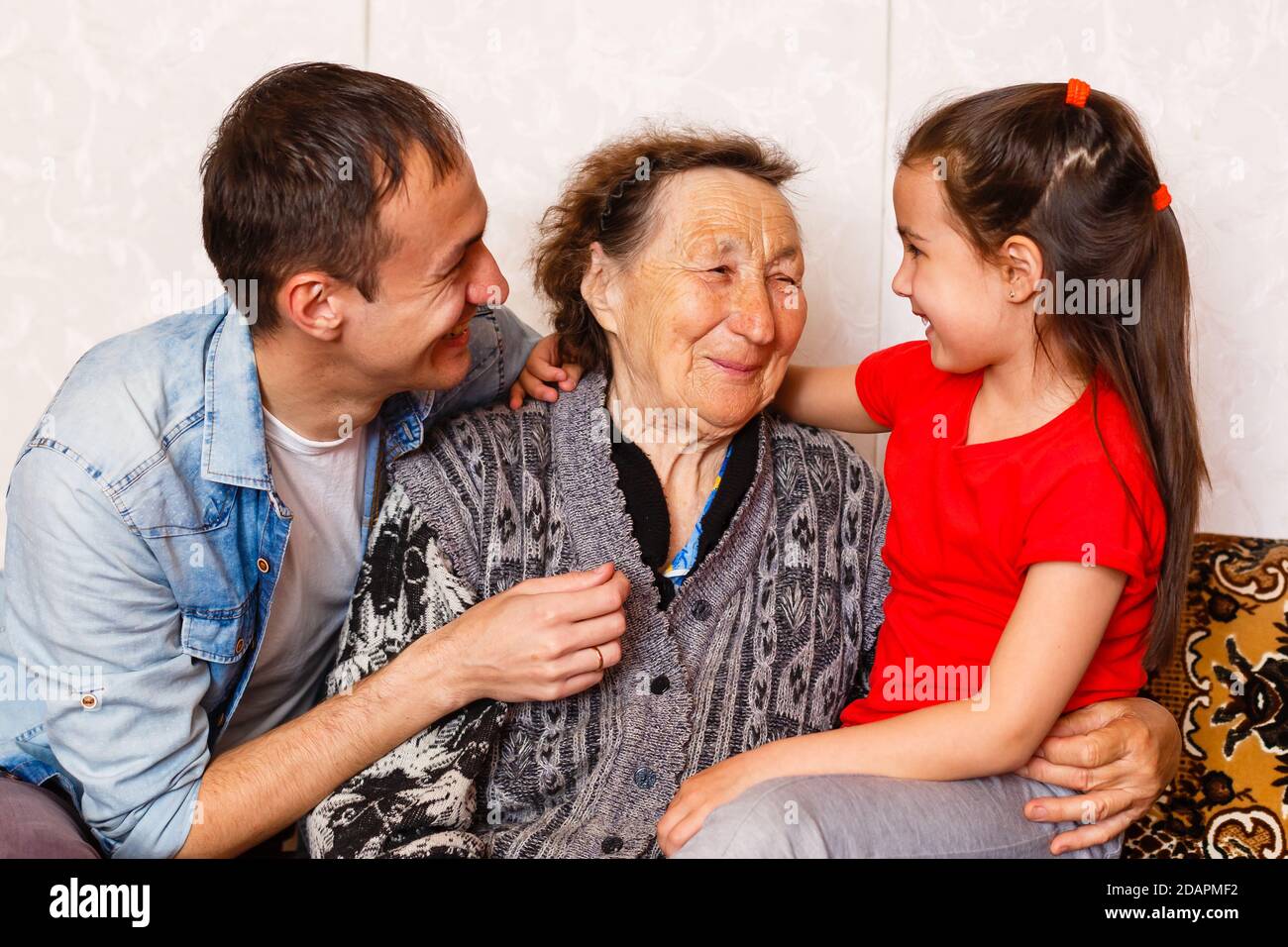 95 Year Old Woman And Her Great Granddaughter Look At The Camera She