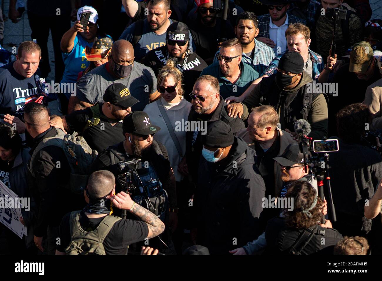 Pushing through crowd hi-res stock photography and images - Alamy