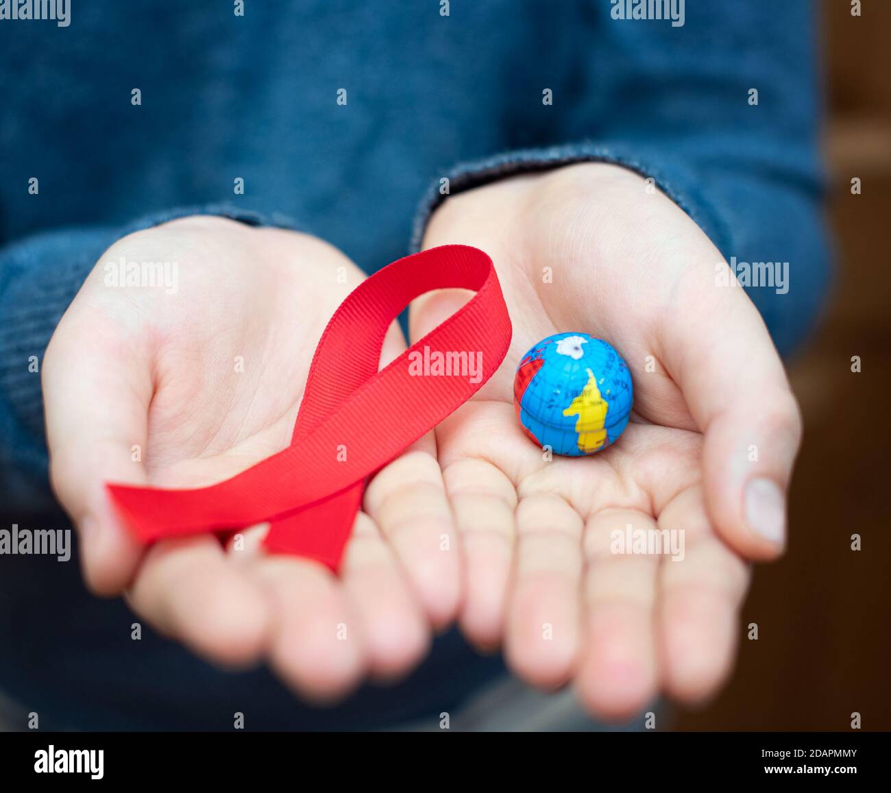 World day of fight against AIDS. The symbols are a red ribbon and an ...