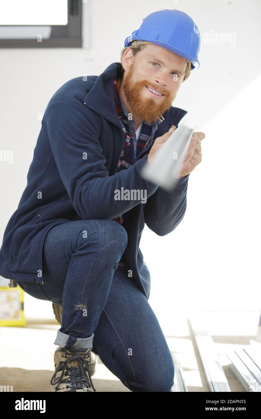 workers installing post rail and spring installation Stock Photo - Alamy