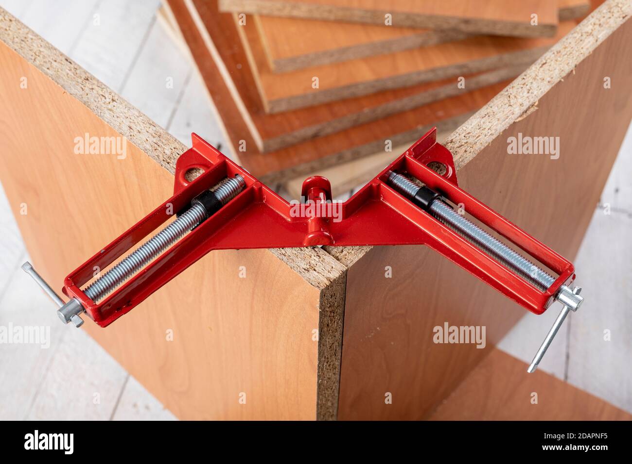 Chipboard in an angular carpentry clamp. Fixing the material for ...