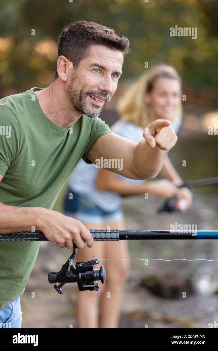 Young man pointing fish hi-res stock photography and images - Alamy