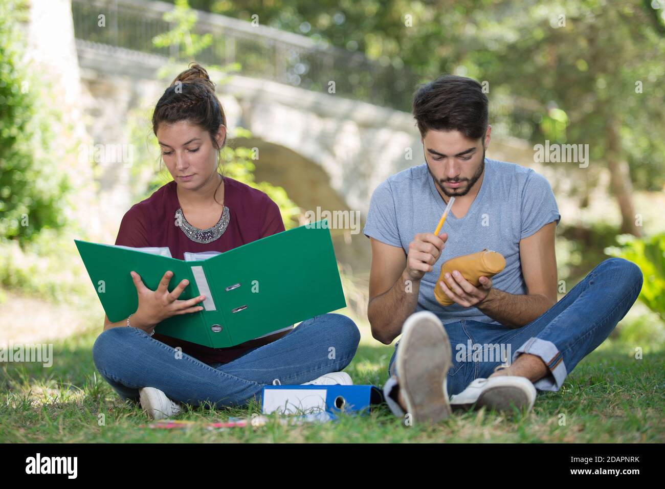 college students working together outdoors Stock Photo - Alamy