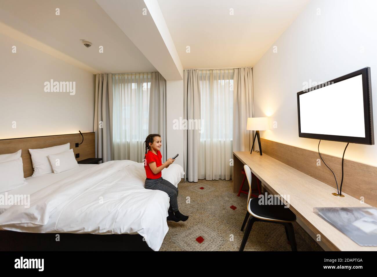 Little girl holding tv remote control Stock Photo - Alamy Little girl holding tv remote control Stock Photo - Alamy