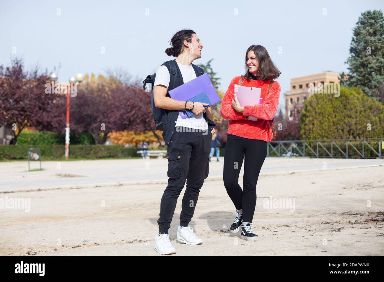 two happy university students at the school campus Stock Photo - Alamy