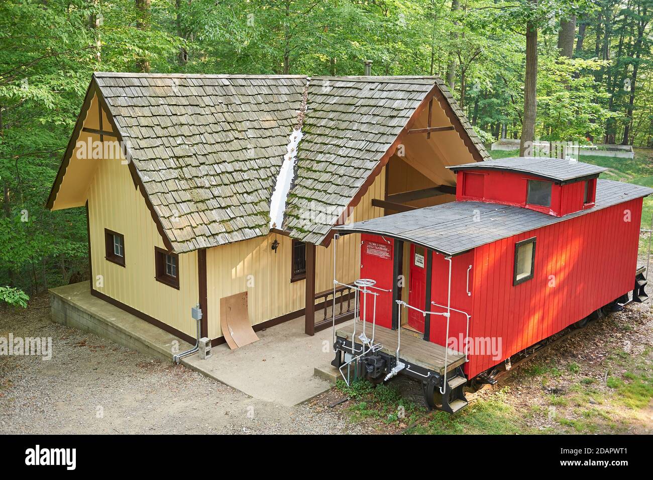 Red caboose and "old" train station Stock Photo - Alamy