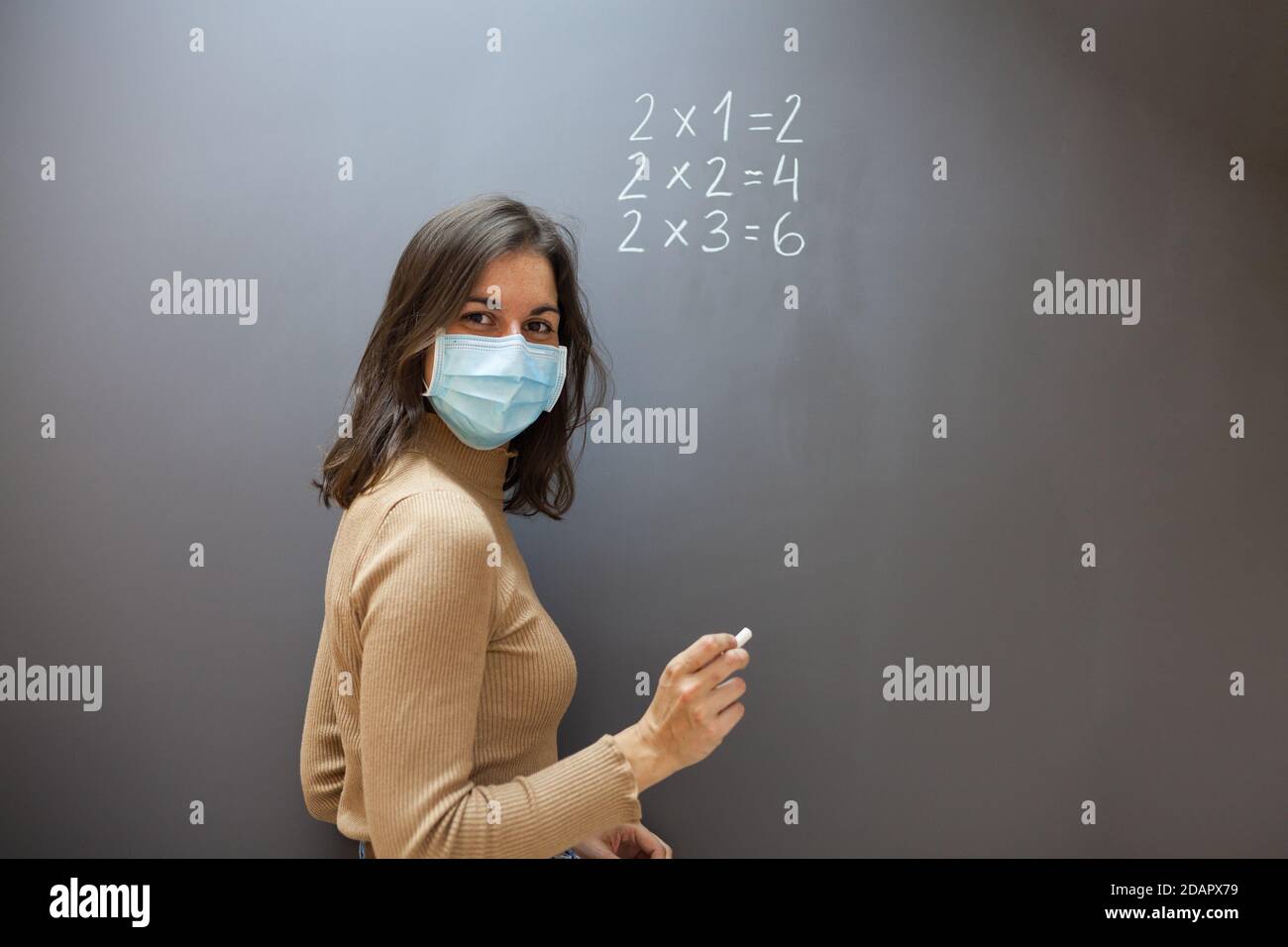 School during covid pandemics female teacher with face mask Stock Photo ...