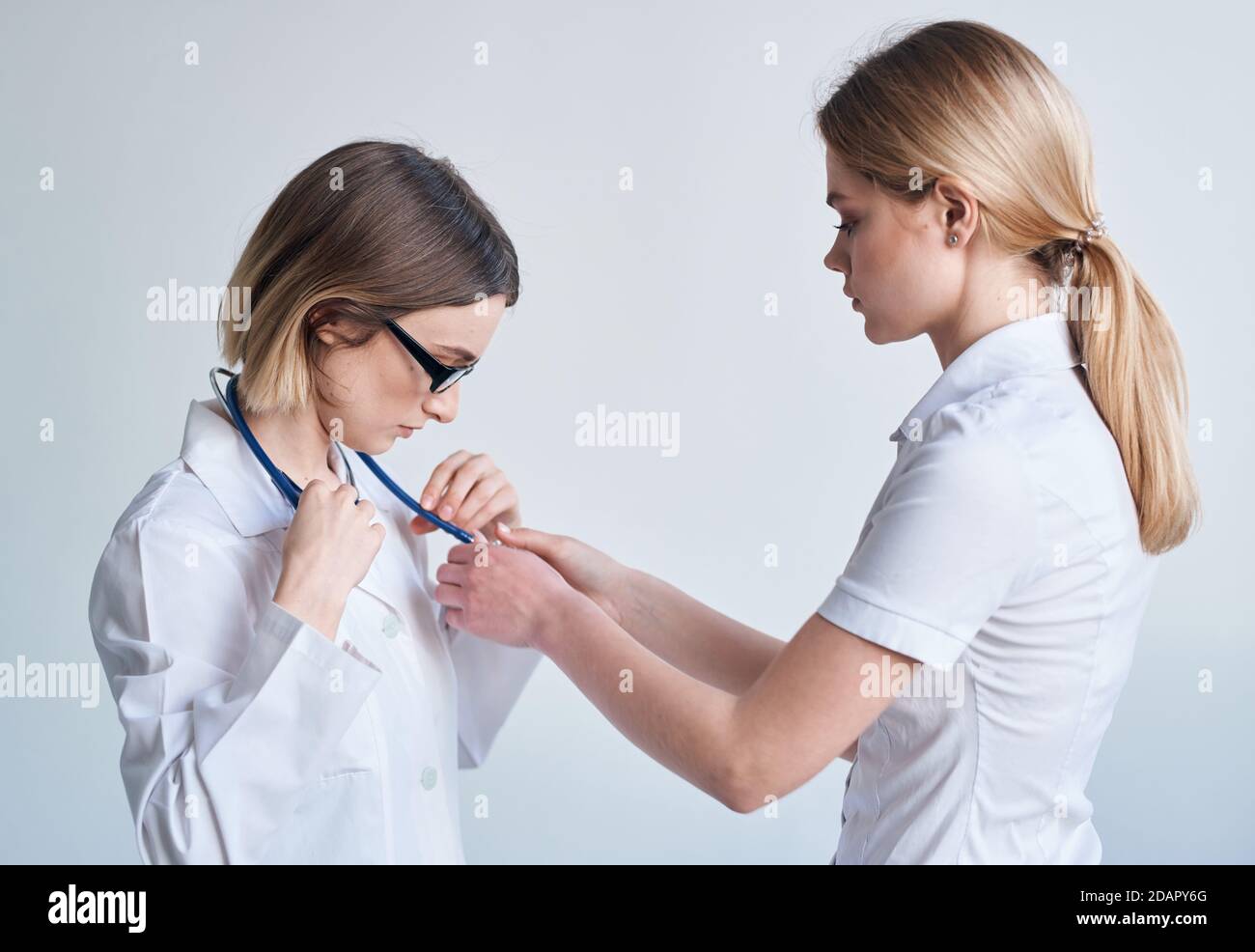 Doctor and patient on light blue background stethoscope health problems ...