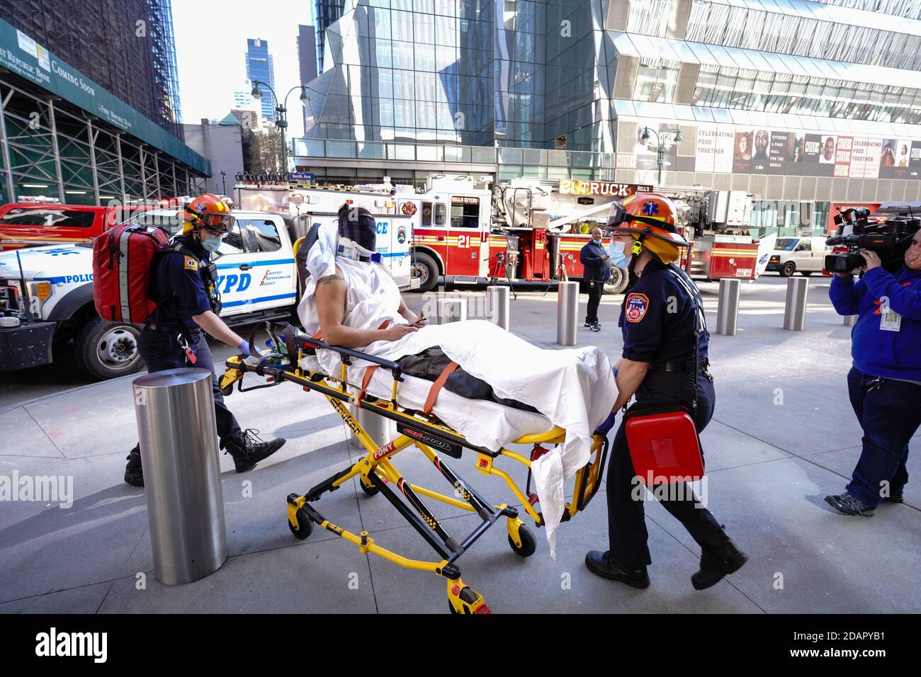 An injured construction worker seen on a stretcher.A scaffolding ...