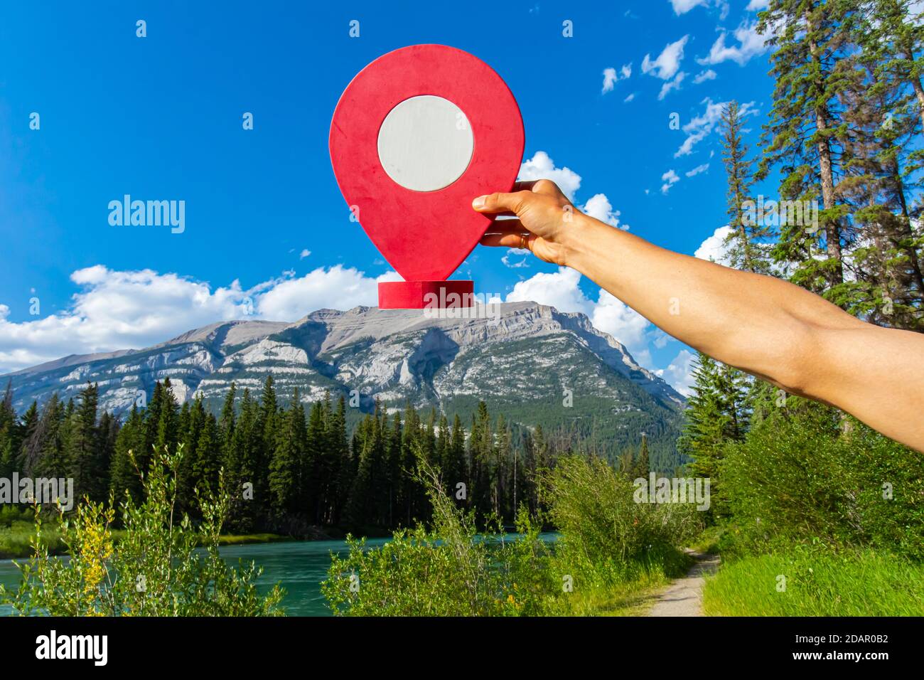 Creative travel destination concept as a person is seen holding a ...