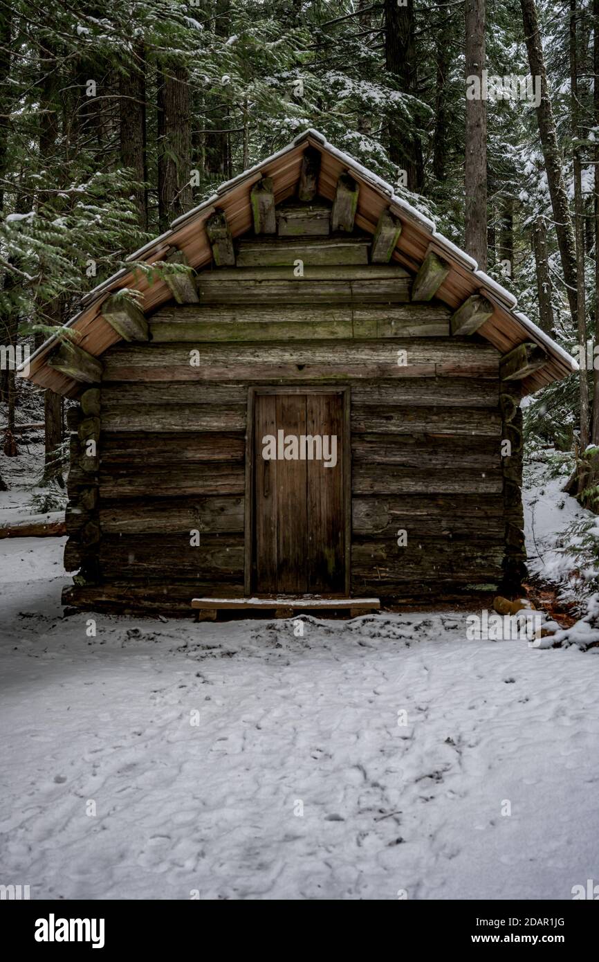 Small Cabin in Snow Along Trail Of The Shadows in winter Stock Photo ...