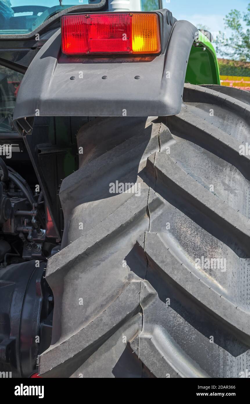Fragment rear wheel and tractor brake light. Tractor fender with brake ...
