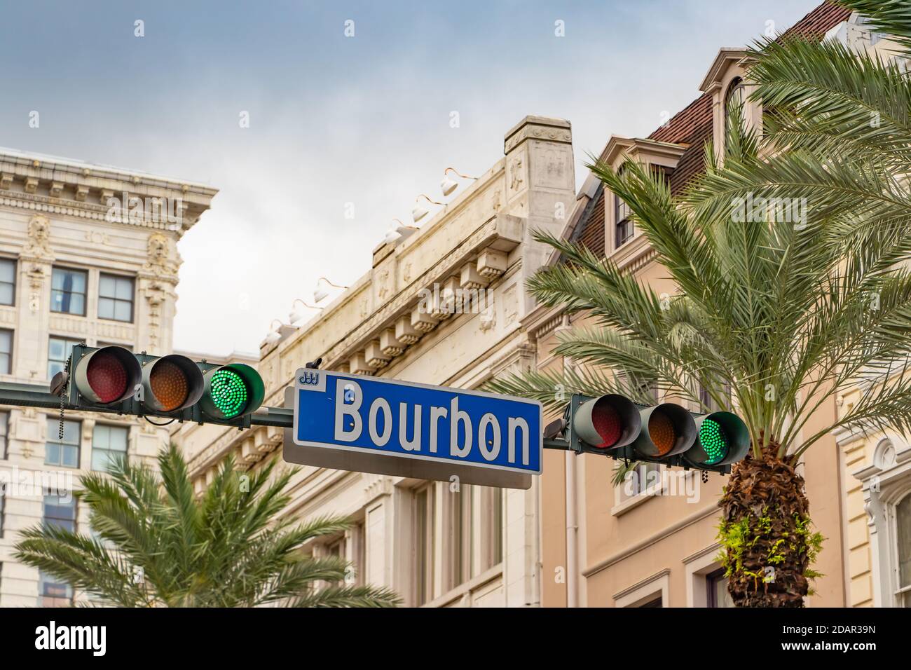 Bourbon Street sign above road with traffic lights in New Orleans ...