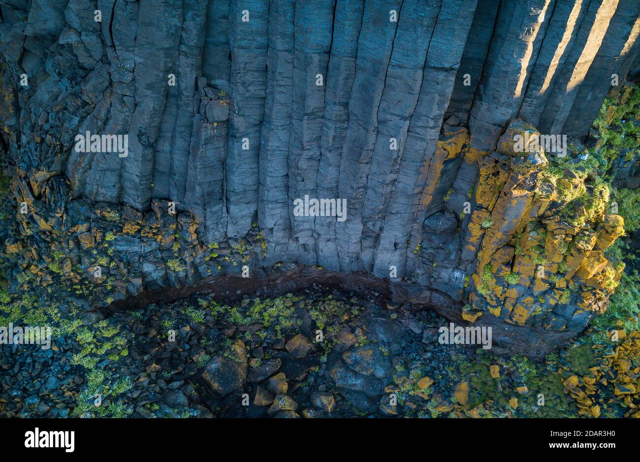 Aerial view of basalt columns with yellow lichen, Langanesbyggo ...