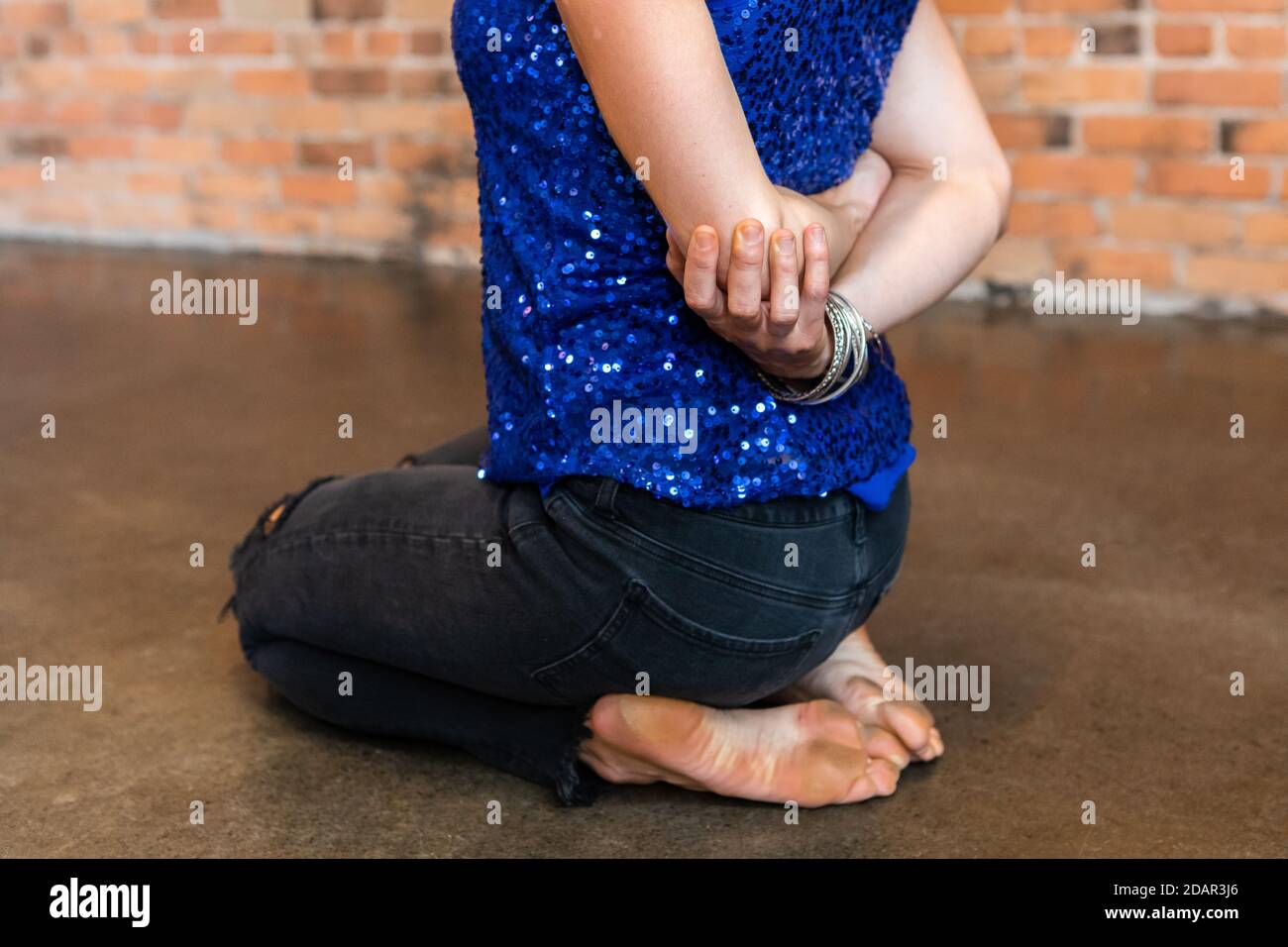 A close up and back view of a woman in a meditative and spiritual ...
