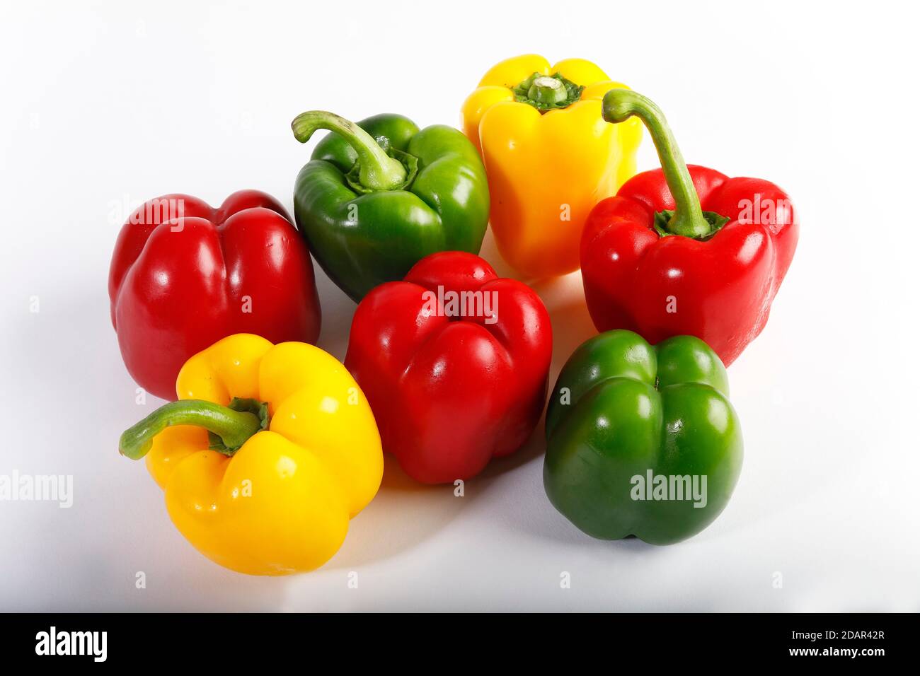 Red, yellow and green peppers (Capsicum annuum), vegetables, studio ...