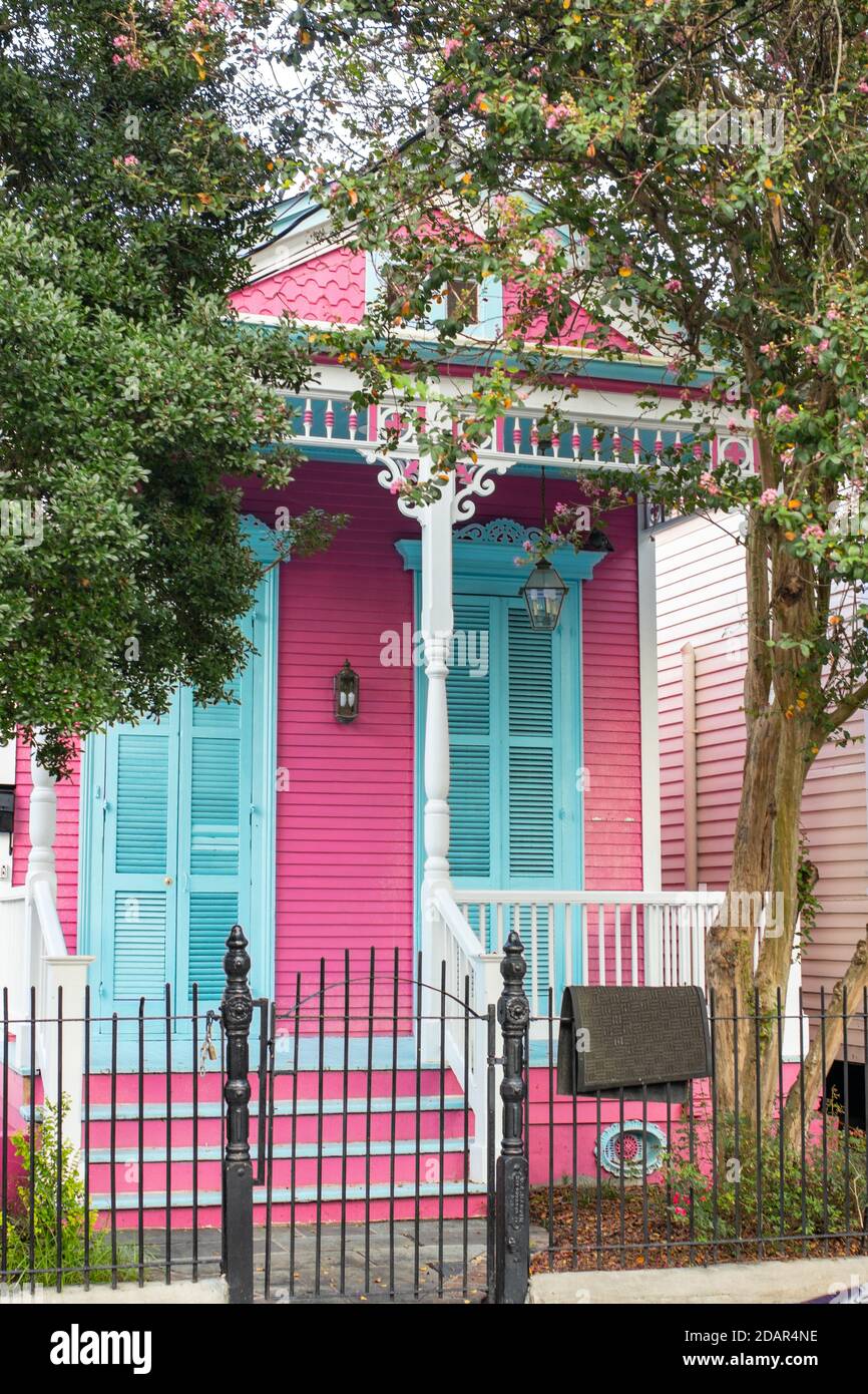 colourful pink and green painted wooden houses and shotgun shacks in ...
