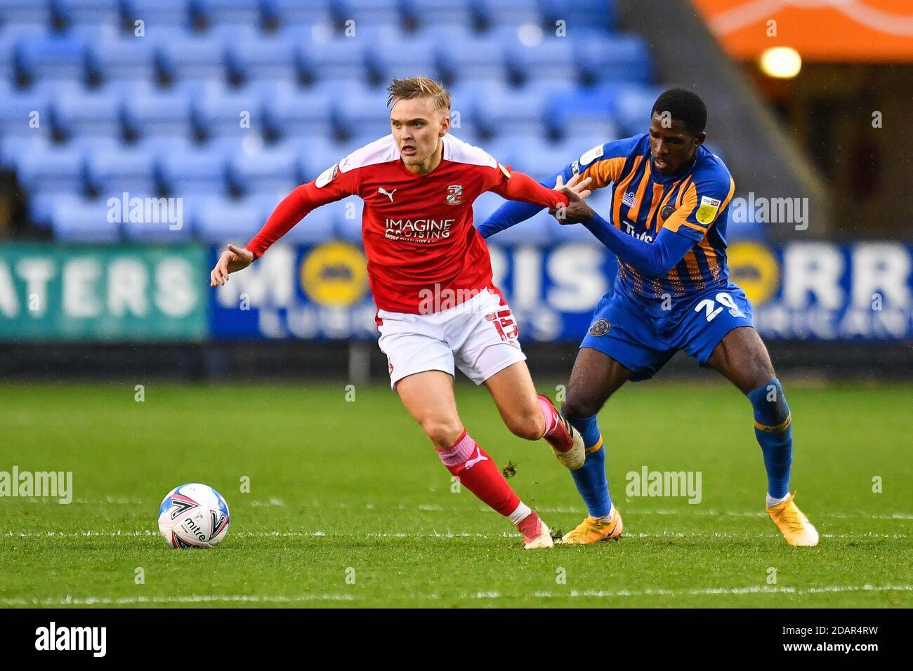Matthew Smith #15 of Swindon Town battles with Shilow Tracey #20 of ...