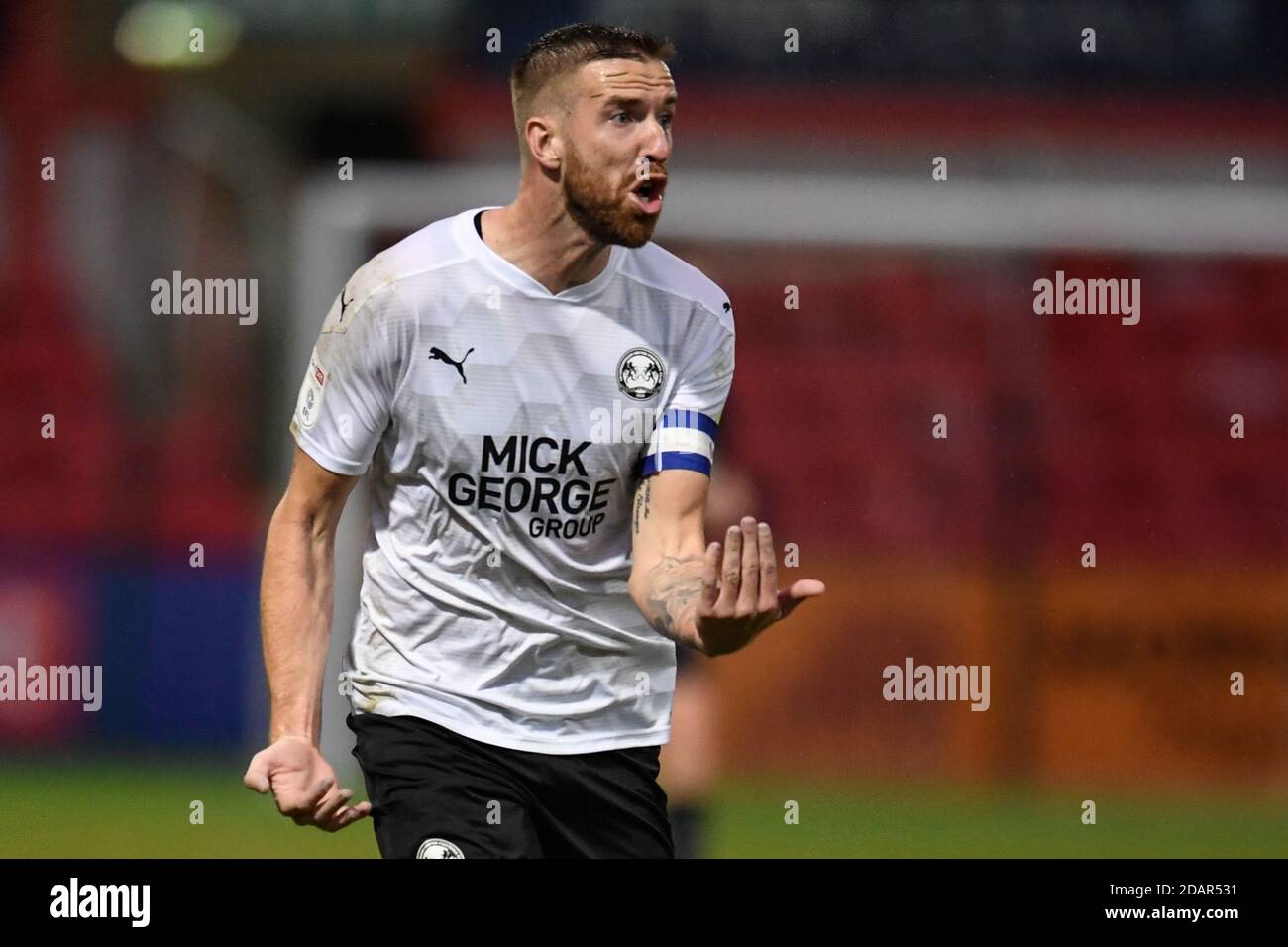 Mark Beevers #5 of Peterborough United shouts instructions during the ...