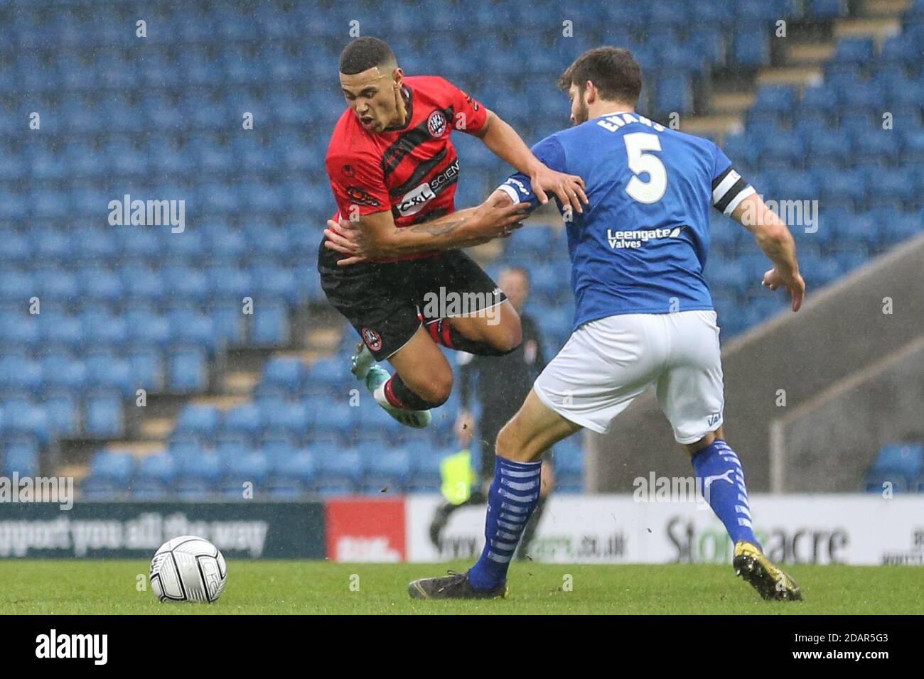 Will Evans #5 of Chesterfield fouls Josh Coley #7 of Maidenhead United ...