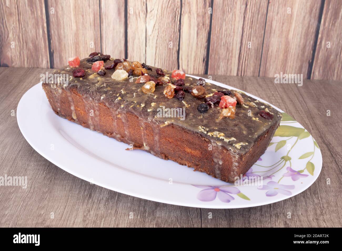 Homemade lemon pudding on a white platter with vintage-style flower ...