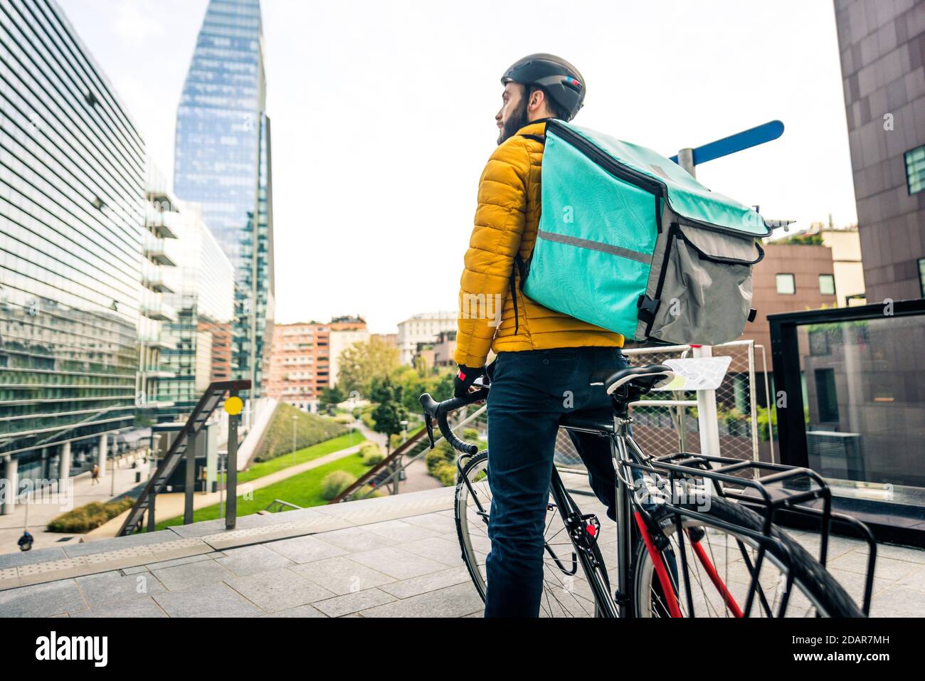 Food delivery service, rider delivering food to clints with bicycle ...