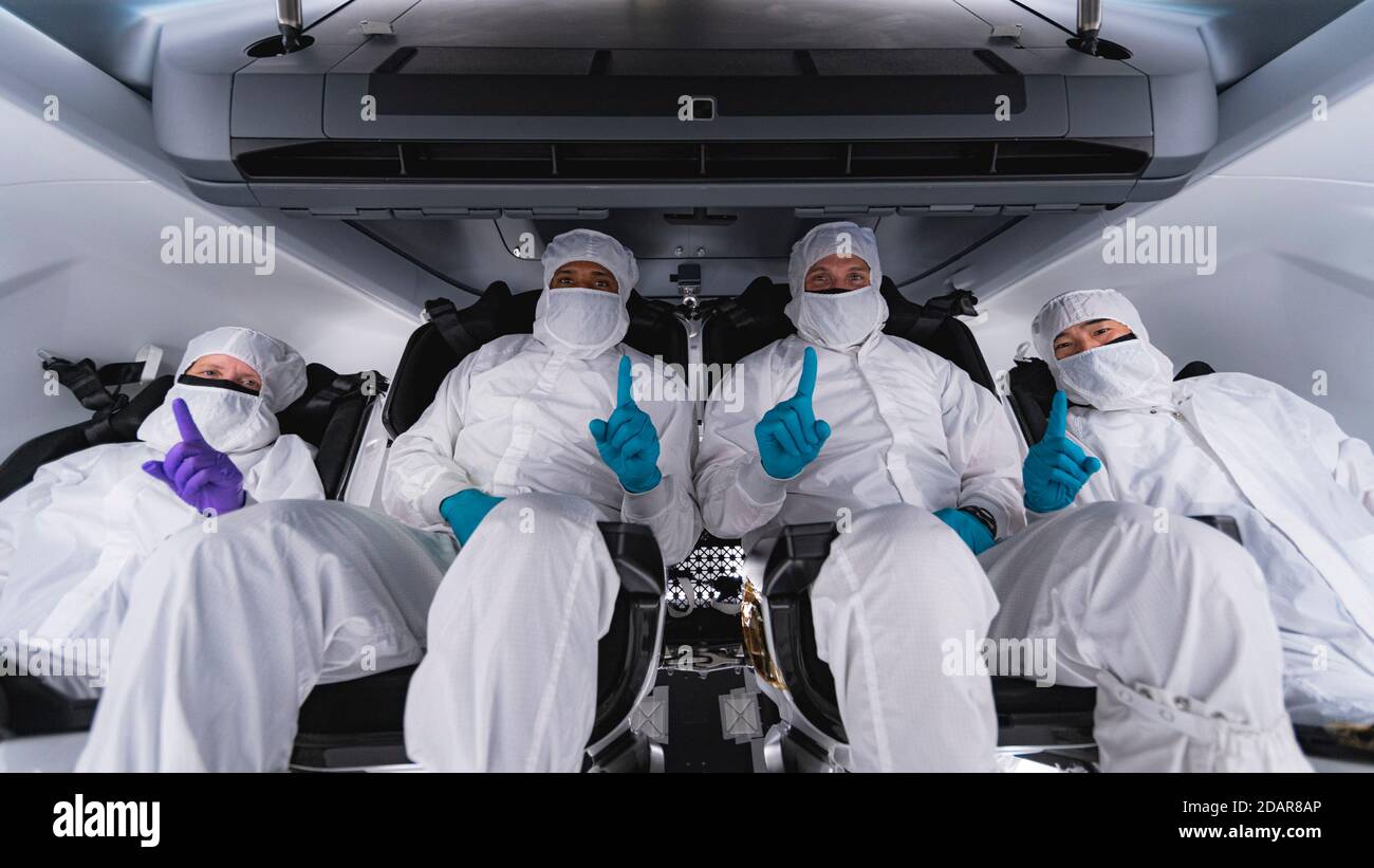 Astronauts for the NASA SpaceX Crew-1 mission during crew equipment ...