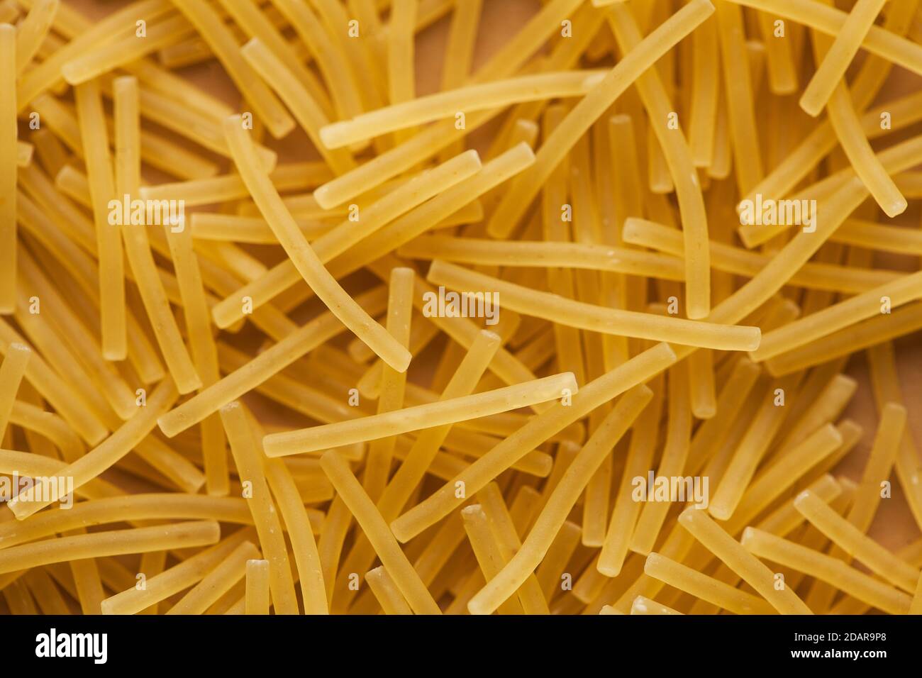 Italian short thin vermicelli on the whole background. Close-up, layout ...