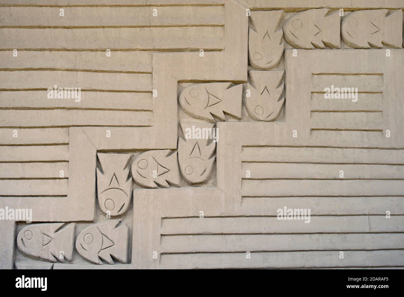 Relief with fishes on the wall of mud brick, ruins of Chan Chan ...
