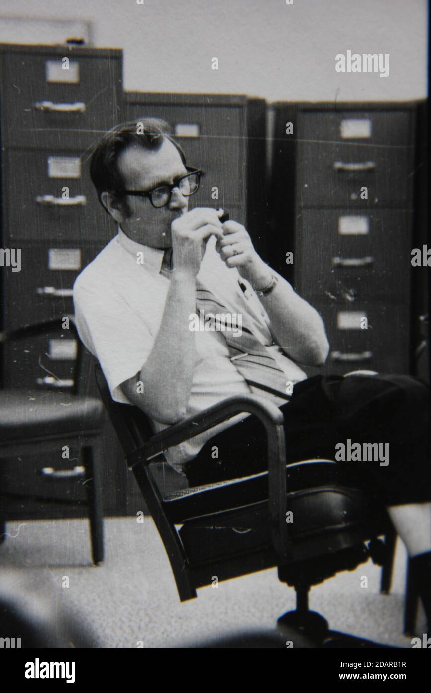 Fine 1970s vintage black and white photography of a man smoking a pipe ...