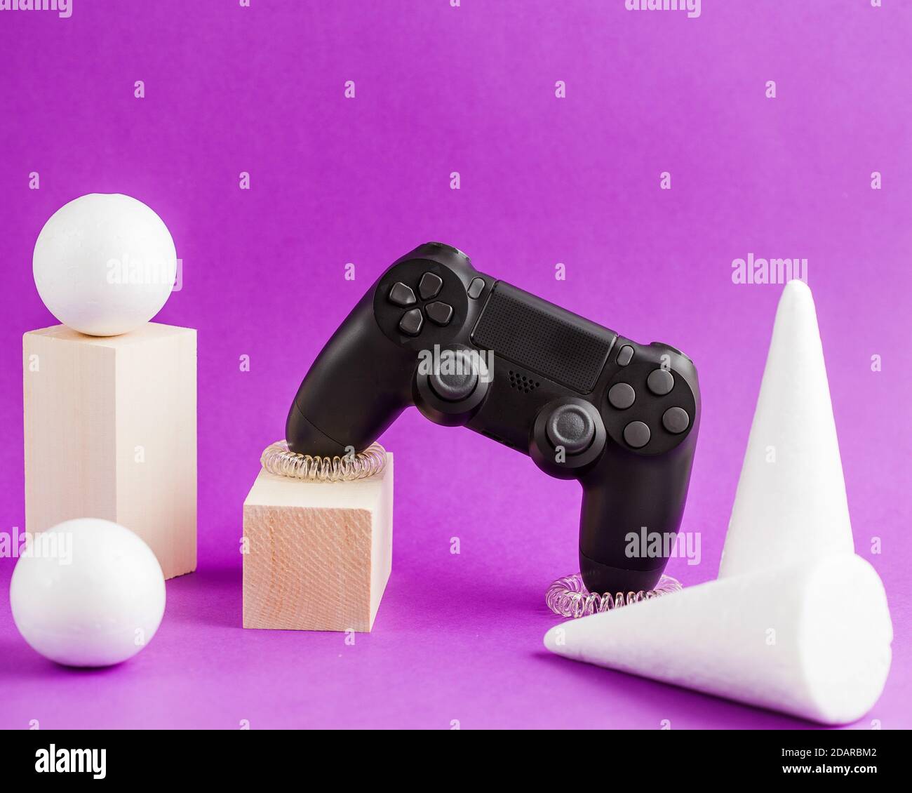 Black game joystick hanging in space, white three-dimensional geometric ...