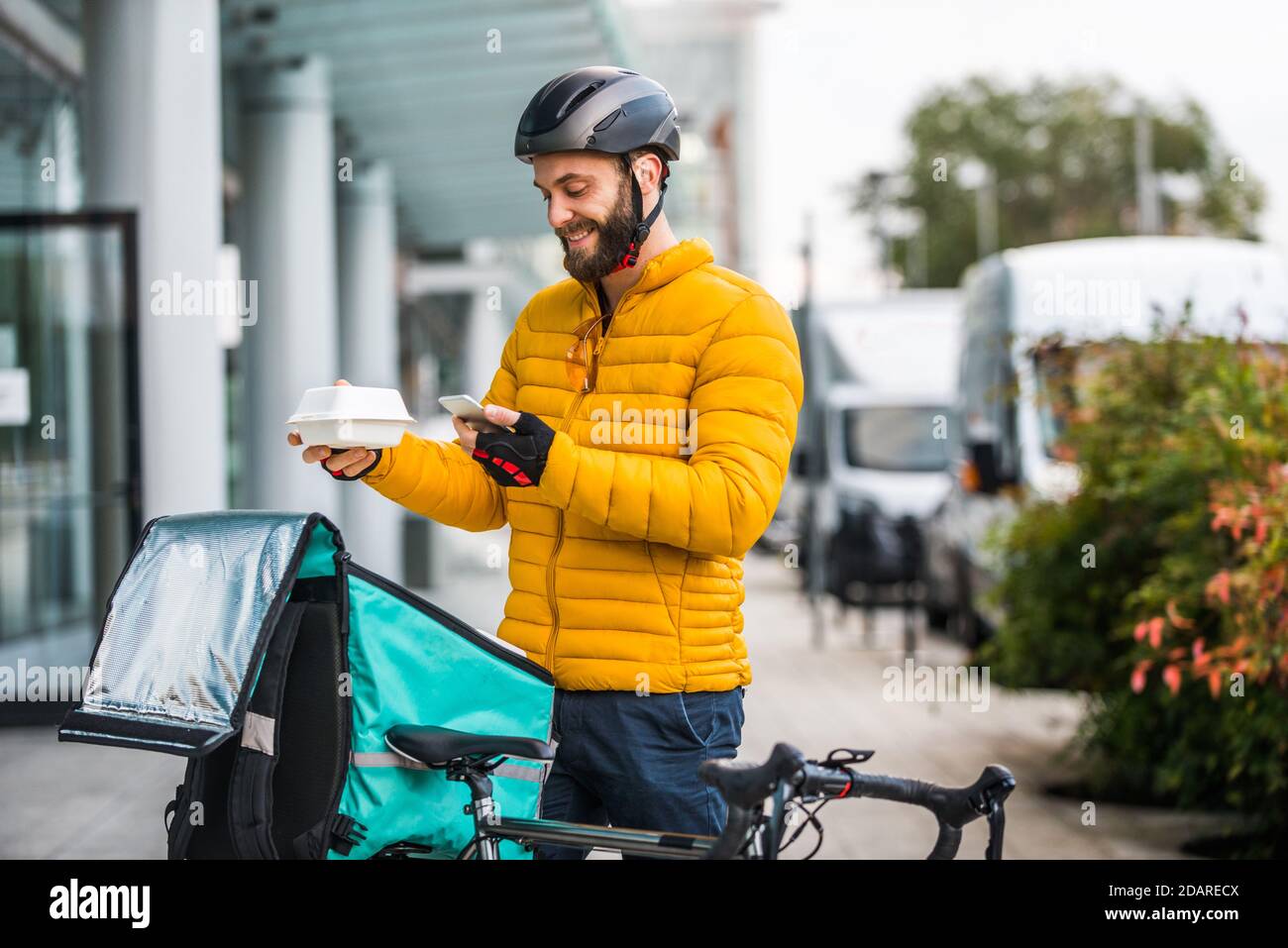 Food delivery service, rider delivering food to clints with bicycle ...