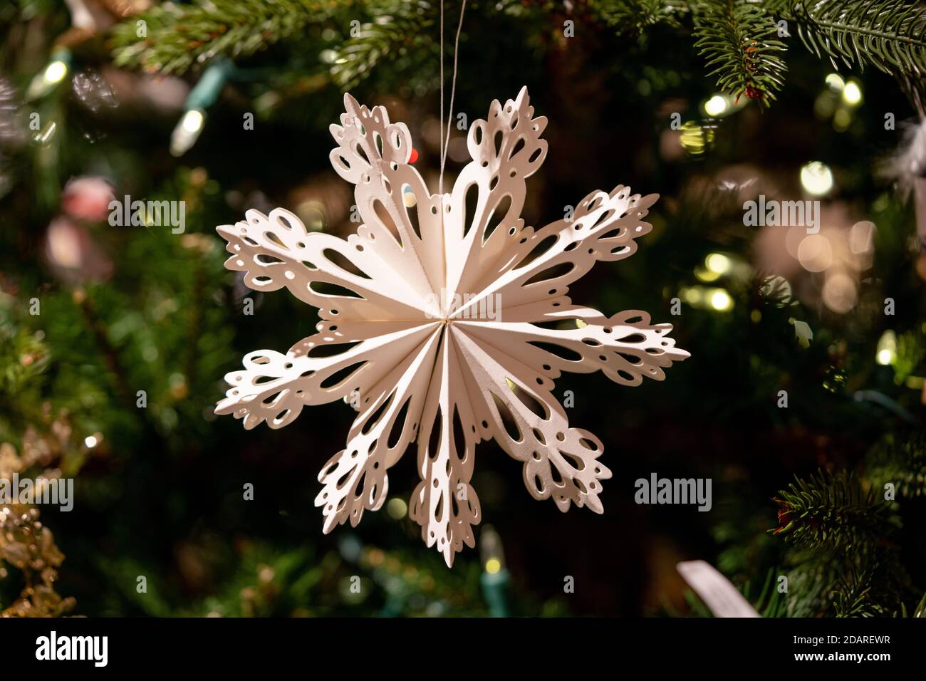 Paper snowflake hanging on a holiday tree Stock Photo - Alamy