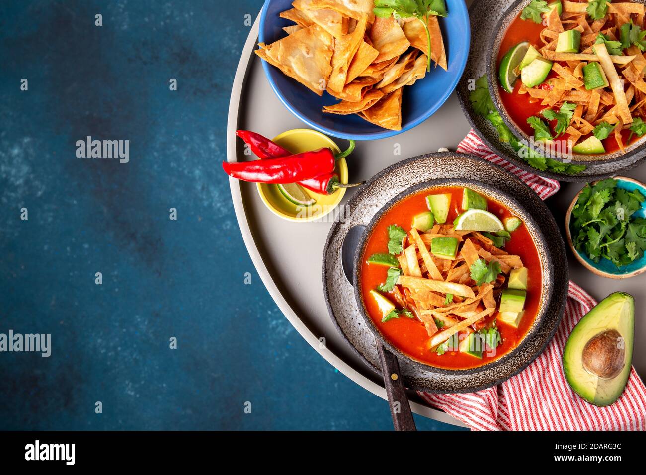 Mexican style table with spicy aztec soup with tortilla. Copy space ...