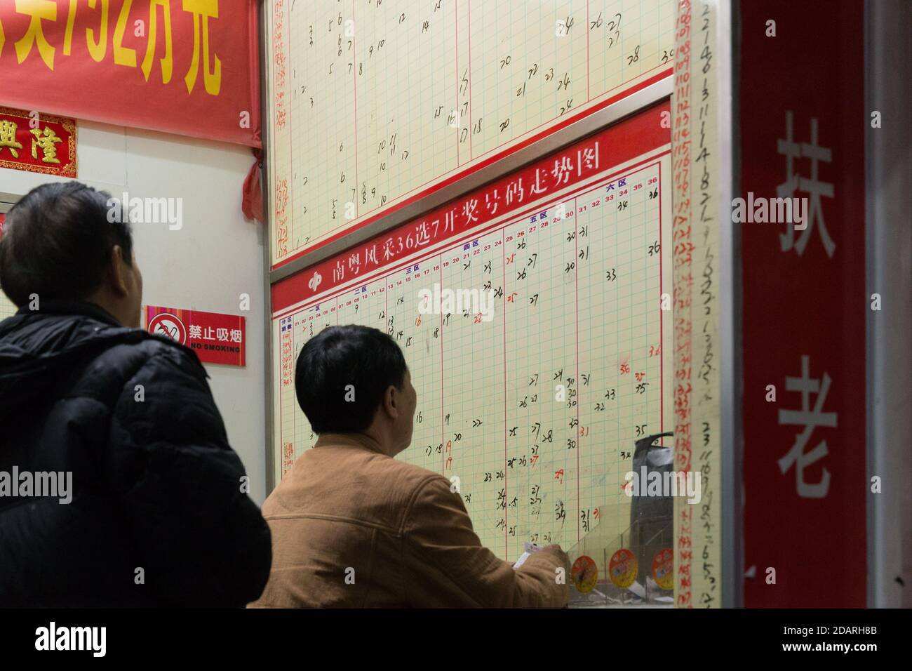 Playing the lottery from a street vendor Stock Photo - Alamy