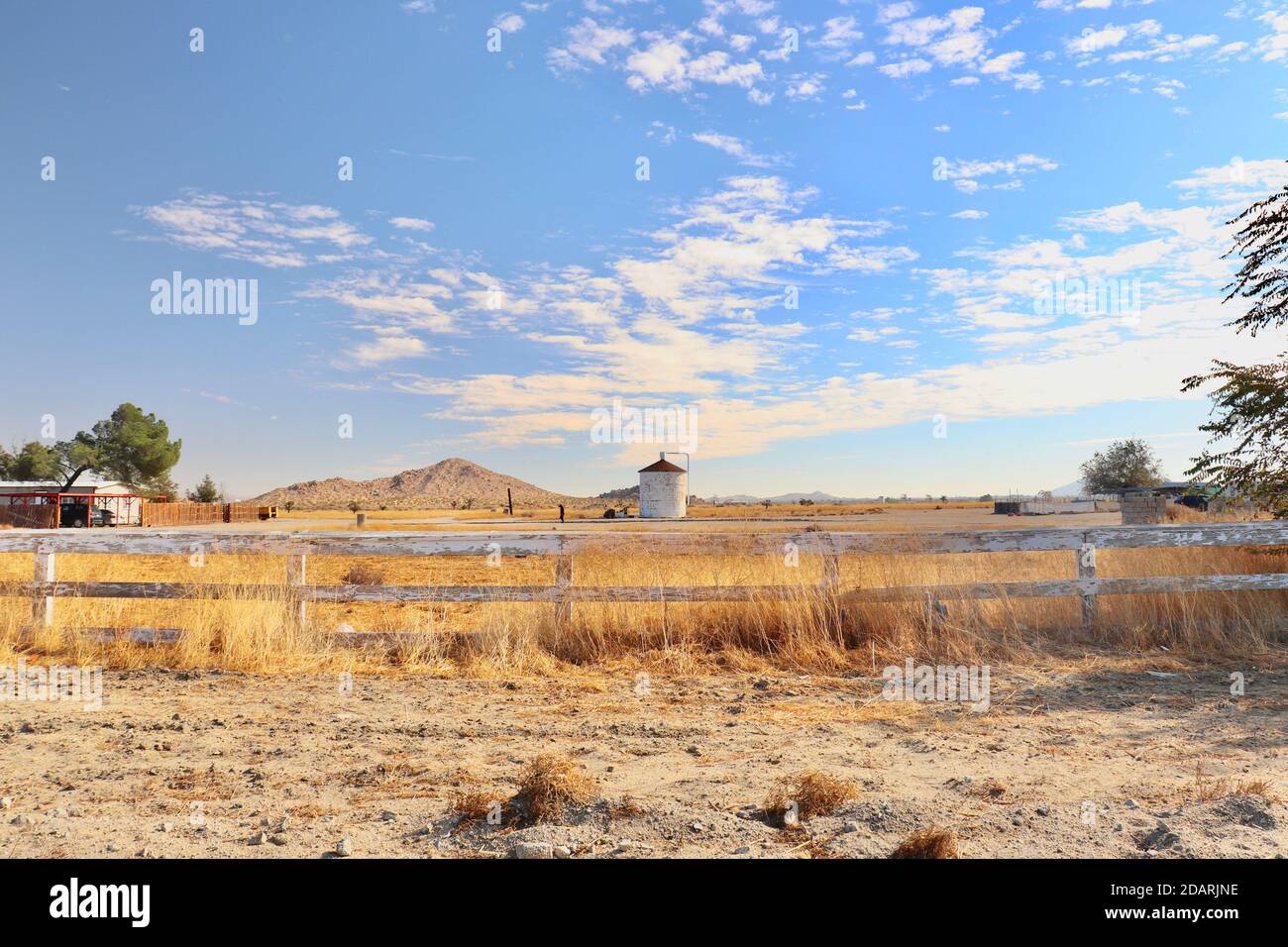 Rustic fence with rural desert landscape Stock Photo - Alamy