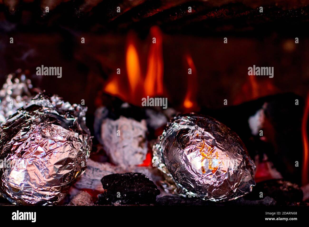 meat and vegetables cooking over fire on a grill Stock Photo - Alamy