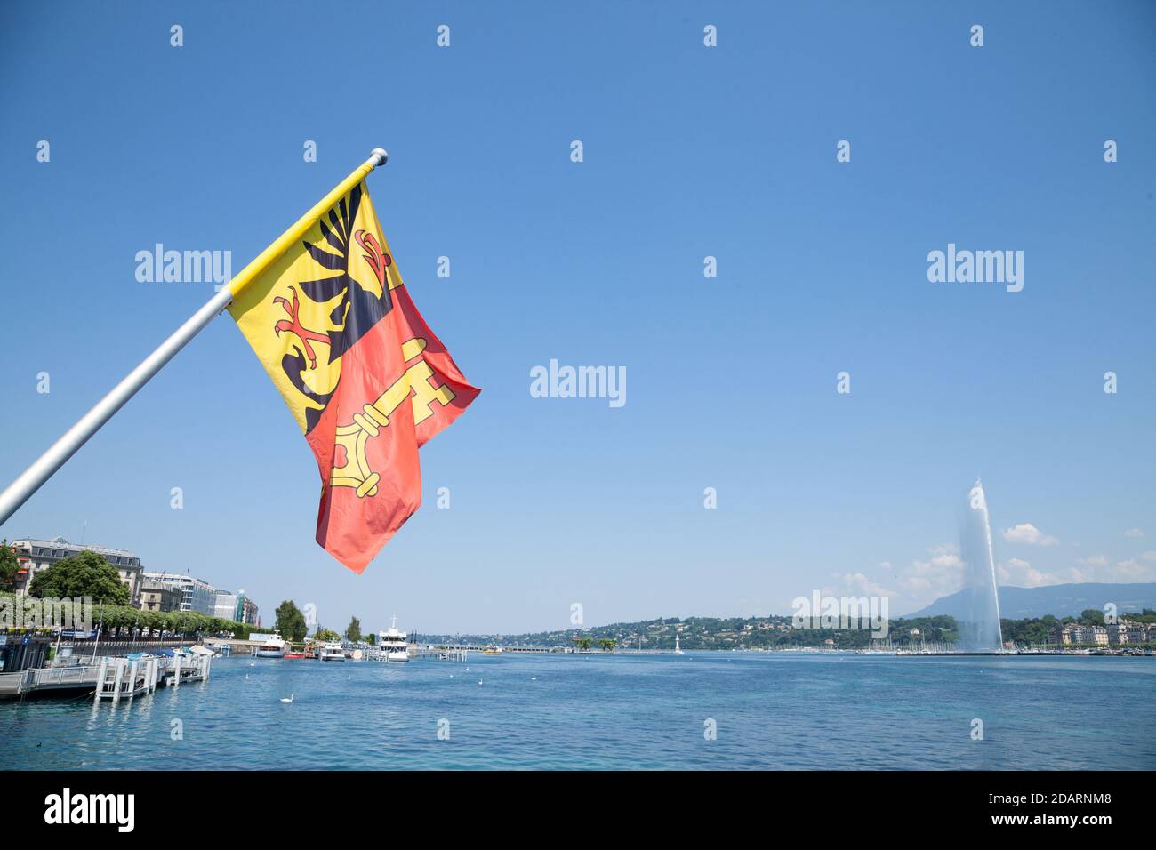Flag of the Geneva Canton in the city center of Geneva, on the Leman ...