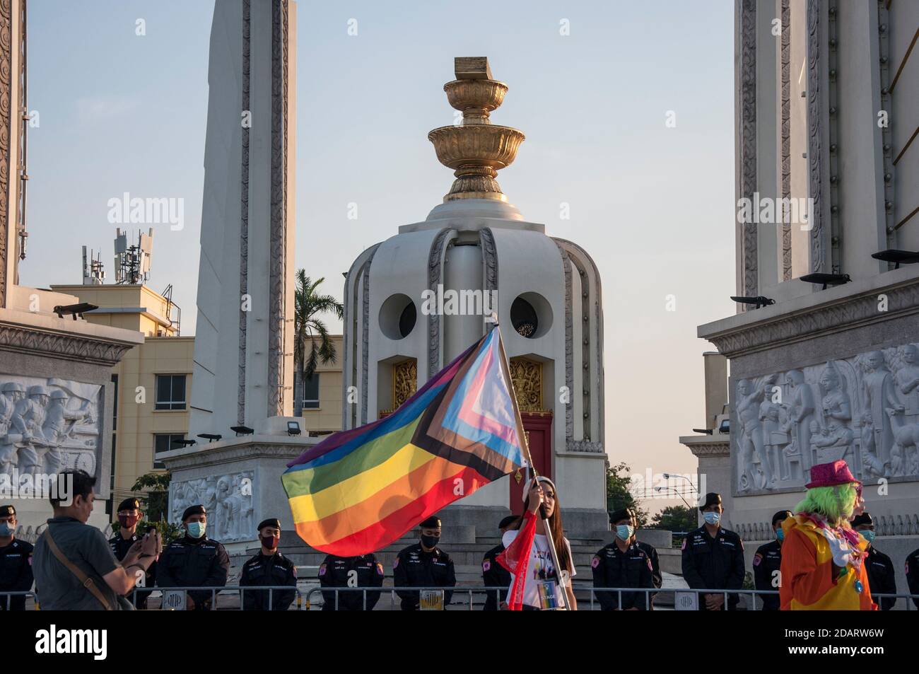 Protester waves rainbow flag hi-res stock photography and images - Alamy