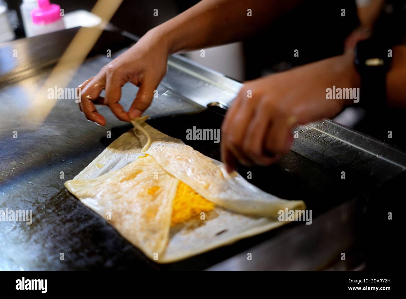 Fried roti with eggs in hot pan 1 Stock Photo - Alamy